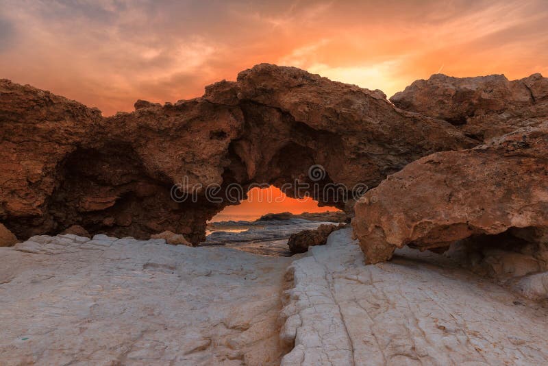 Natural Arch at Sunset on Cyprus Beach. Stock Photo - Image of coral ...