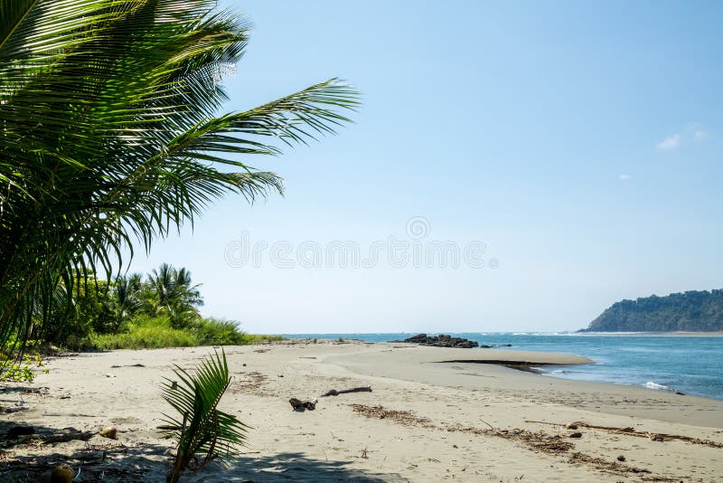 A natural beach stock image. Image of rock, clouds, rica - 63992585