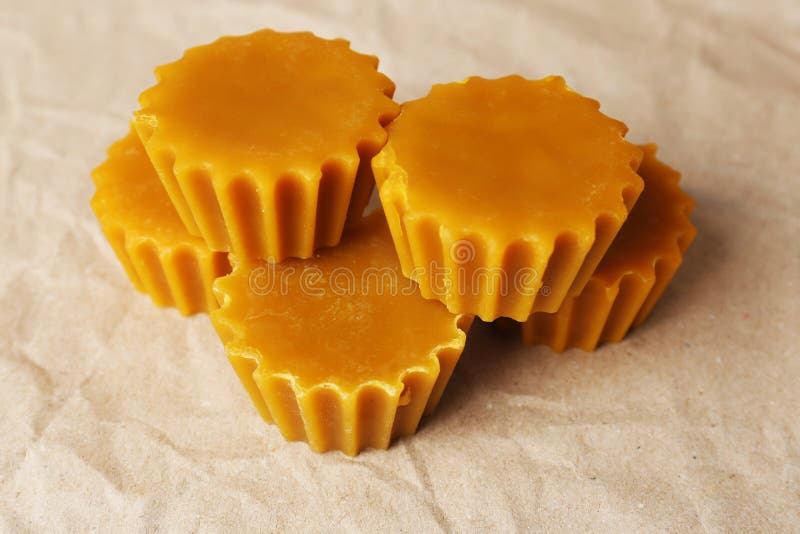 Natural Beeswax Cake Blocks on Parchment Paper, Closeup Stock Image ...