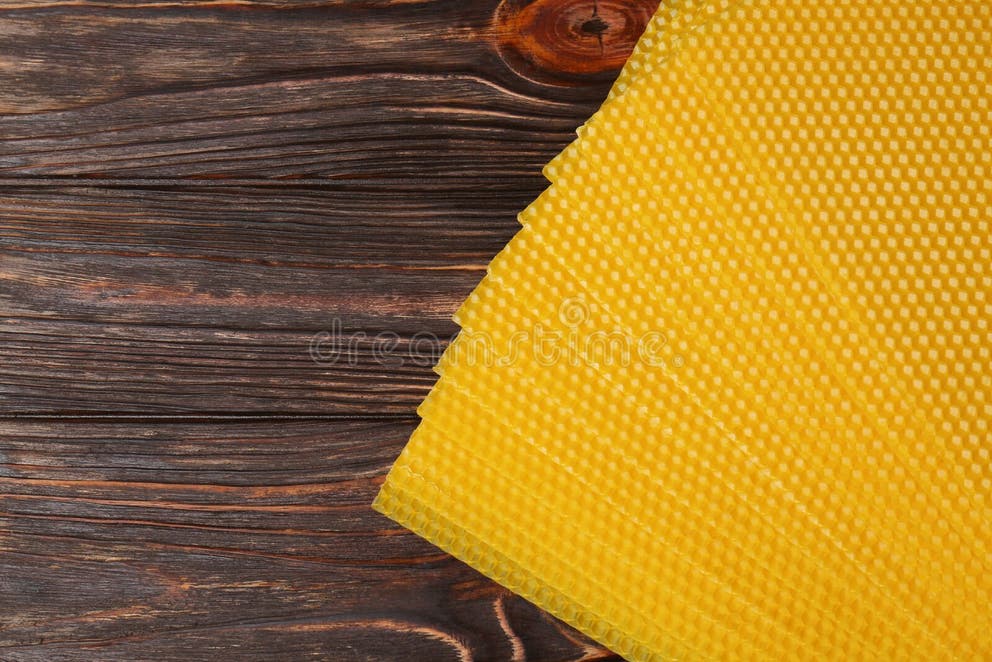Natural Beeswax Sheets on Wooden Table, Flat Lay. Space for Text Stock ...