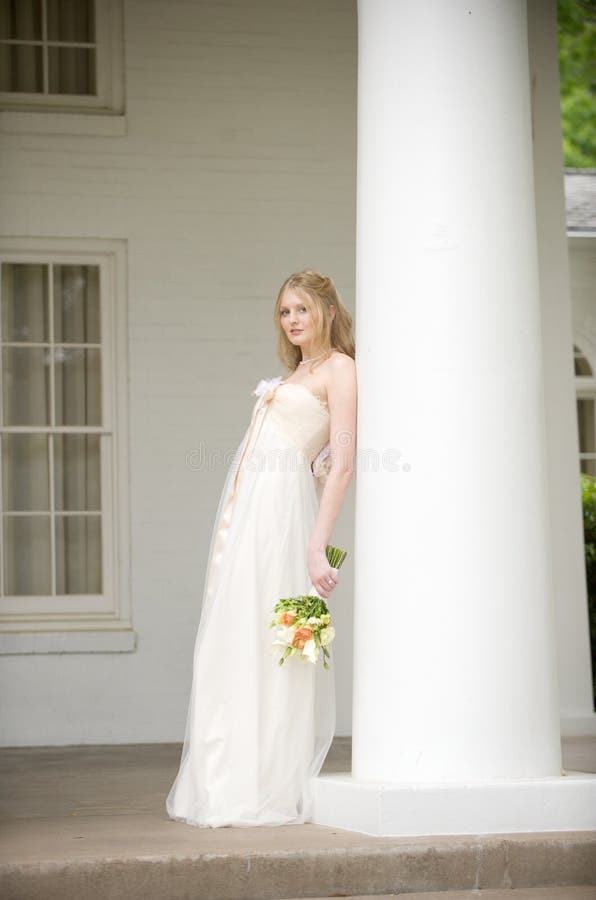 Natural Bride Leaning Against Column Stock Image - Image of lovely ...