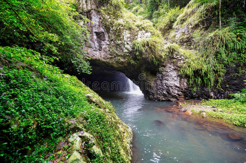 Natural Bridge Falls with a Cave and a Waterfall in the Background ...