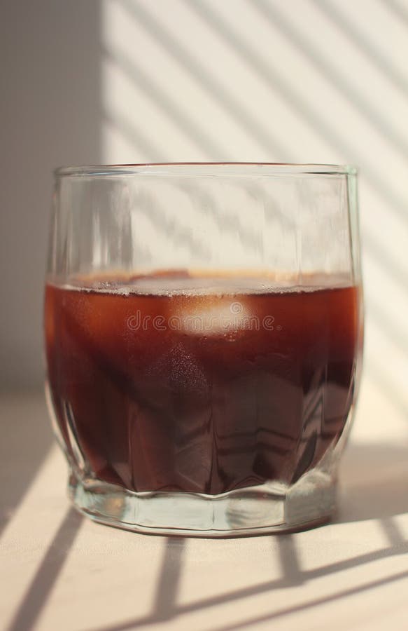 Natural Coffee with Ice Cubes and Cream in a Glass Glass Stock Photo ...