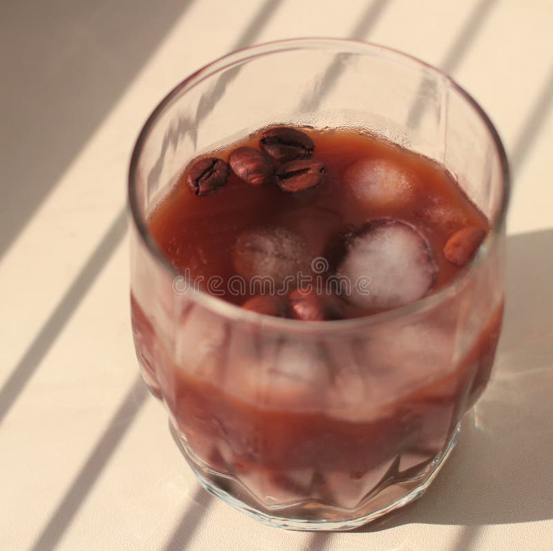 Natural Coffee with Ice Cubes and Cream in a Glass Glass Stock Image ...