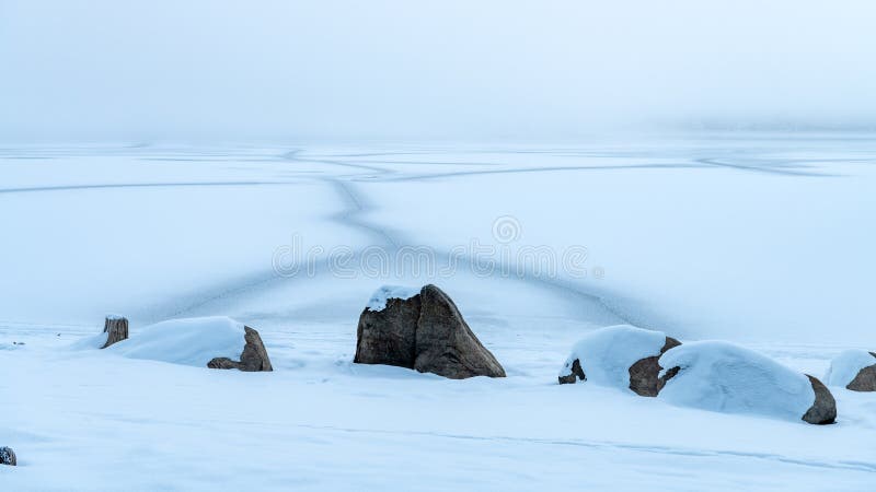 Natural Cracks in Ice of a Lake Winter with Rocks Stock Image - Image ...