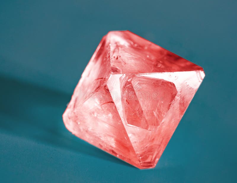 Natural Crystal of the Red Mineral Spinel on a Blue Background Stock ...