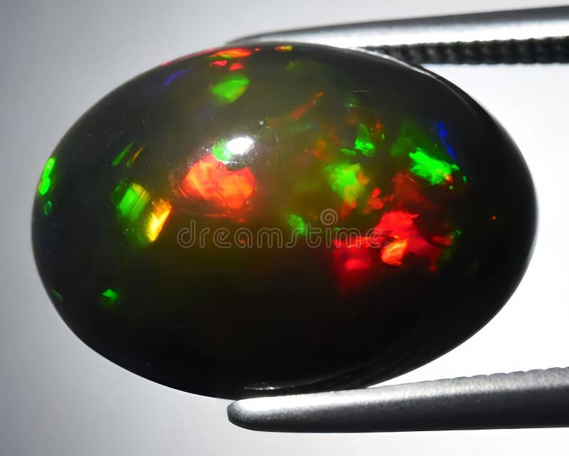 Natural Dark Multicolor Rainbow Opal Gem on the Background Stock Image ...