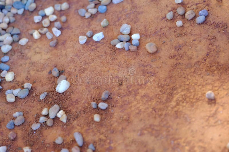 Blurred a Group of Small Rocks on Brown Rustic Metal Sheet Stock Photo ...