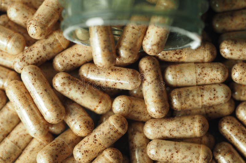 Natural Dietary Supplements in Capsules Scattered on a Surface Stock ...