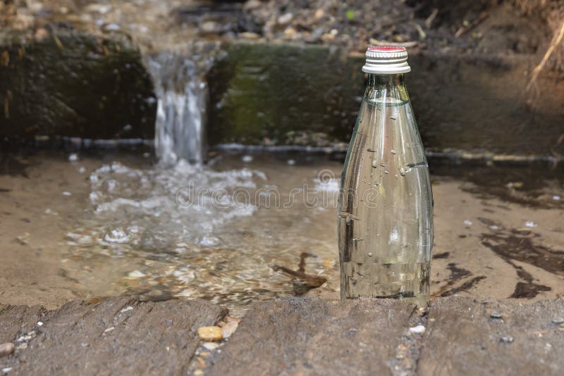 Natural Ecological Spring Water. Glass Bottle with Cold Water Stock ...