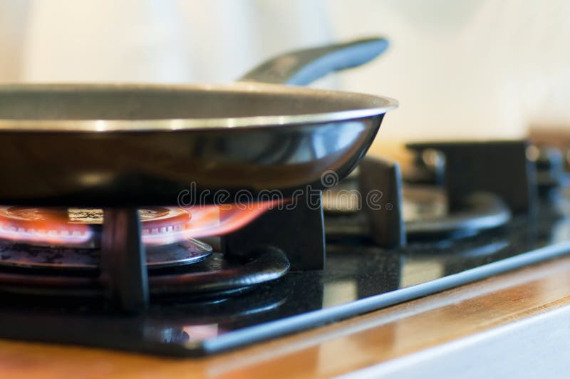 Cooking on a gas stove stock photo. Image of cooker, grid - 6692646