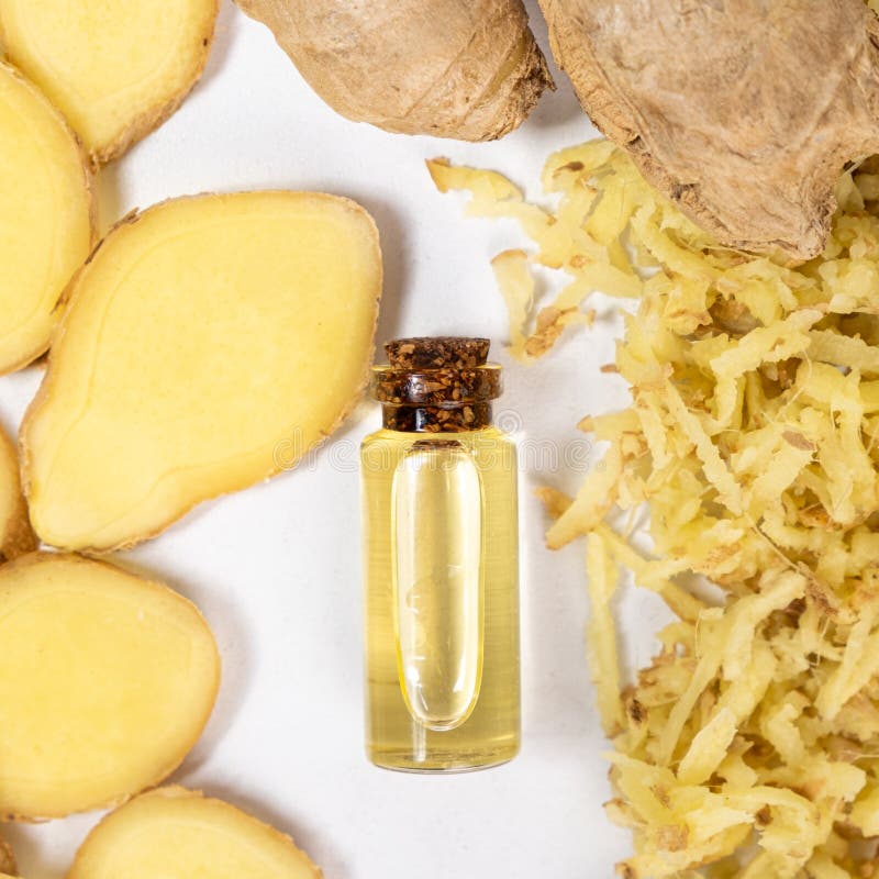 Natural Ginger Oil in Glass Bottle among Ginger Roots Stock Photo ...