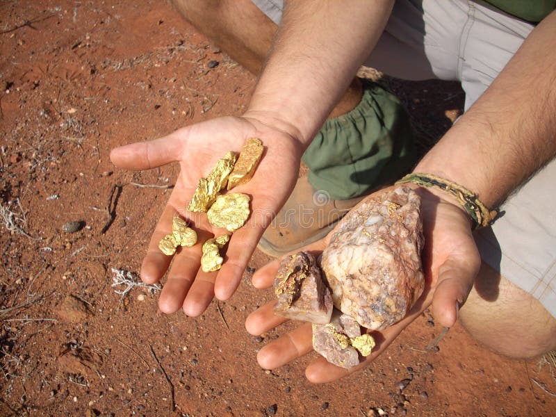 Natural gold in hands stock photo. Image of jewelery - 25183746