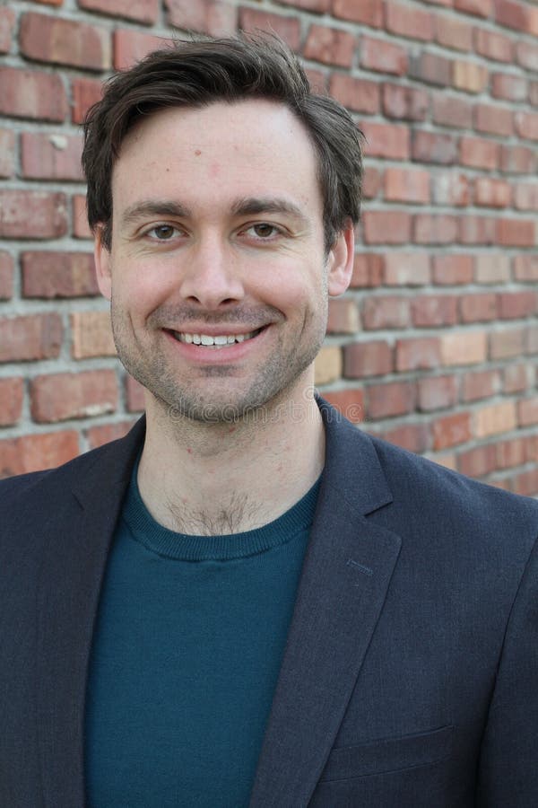 Natural Good Looking Young Man Smiling with Space for Copy Over Blue ...