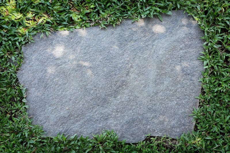 Natural Granite Stone with a Green Grass Frame Around it. Beautiful ...