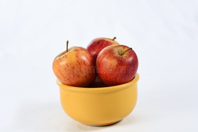 Natural and Healthy Apples Tropical Fruit Inside a Yellow Pot Isolated ...