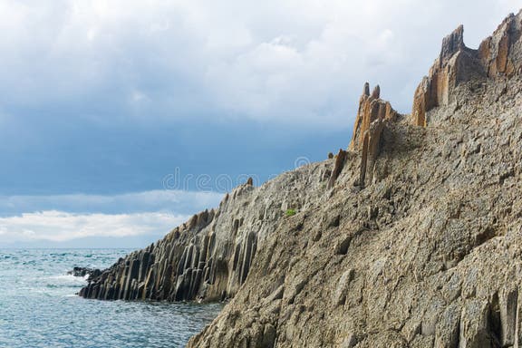 Natural Landscape with a Sheer Cliff Folded Columnar Basalt on the ...