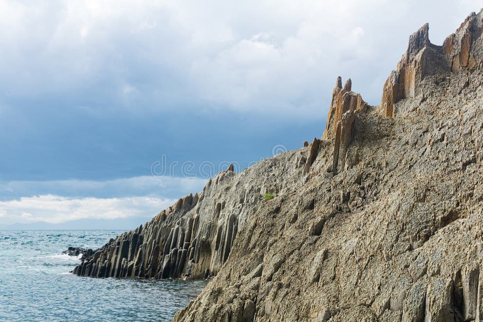 Natural Landscape with a Sheer Cliff Folded Columnar Basalt on the ...
