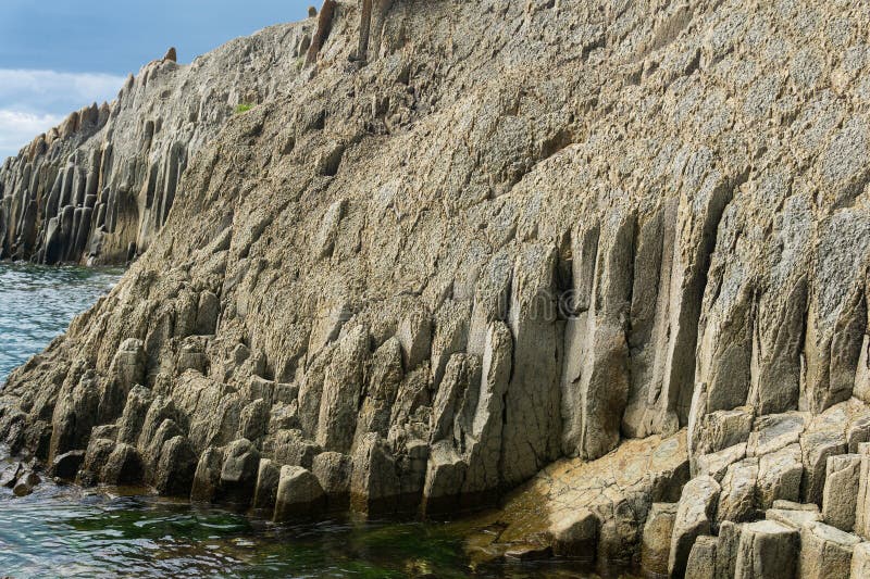 Natural Landscape with a Sheer Cliff Folded Columnar Basalt on the ...