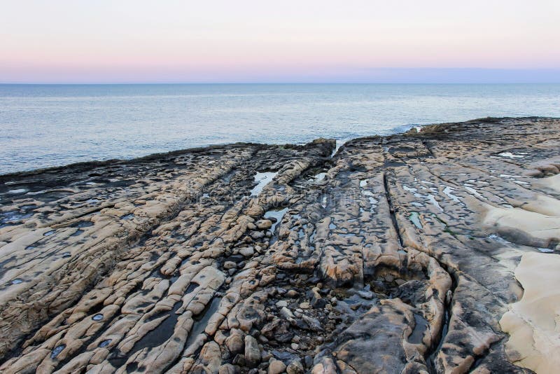 Limestone Beach in Malta at Sunset Stock Photo - Image of coastline ...