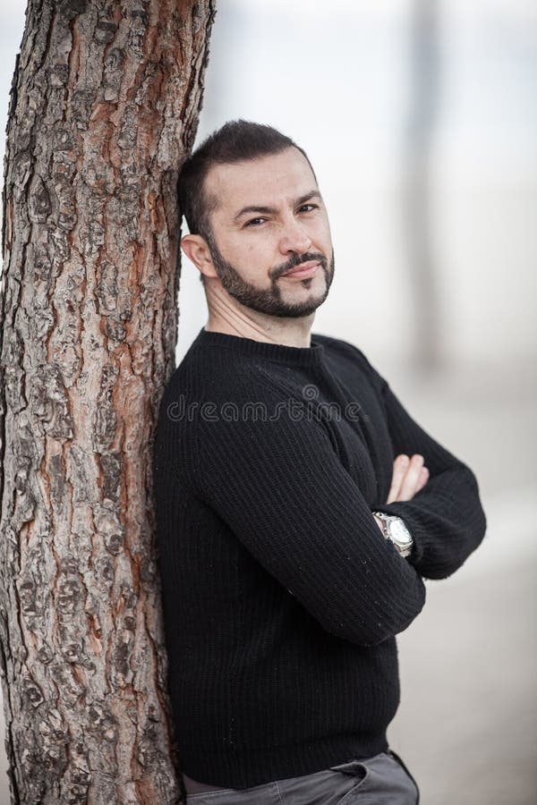Natural Looking Guy Posing Outdoors, Wearing Casual Clothes Stock Image ...