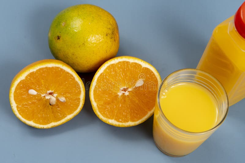 Natural Orange Juice in the Glass with Bottle on the Side Stock Image ...
