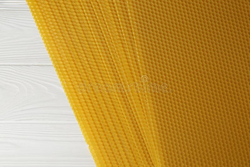 Natural Organic Beeswax Sheets on White Wooden Table, Top View. Space ...