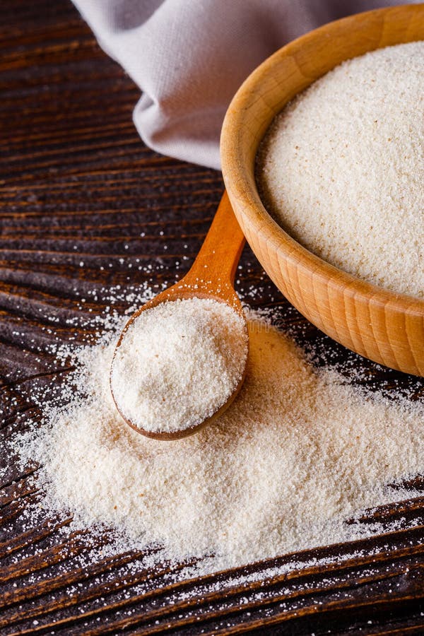 Natural Organic Semolina on Dark Wooden Rustic Background Stock Photo ...