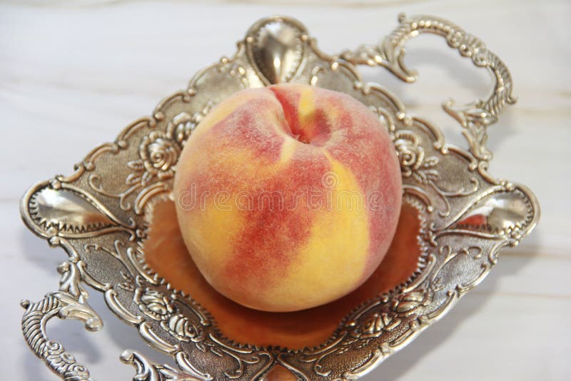 Natural Red Peach in a Decorative Plate Stock Photo - Image of fructose ...