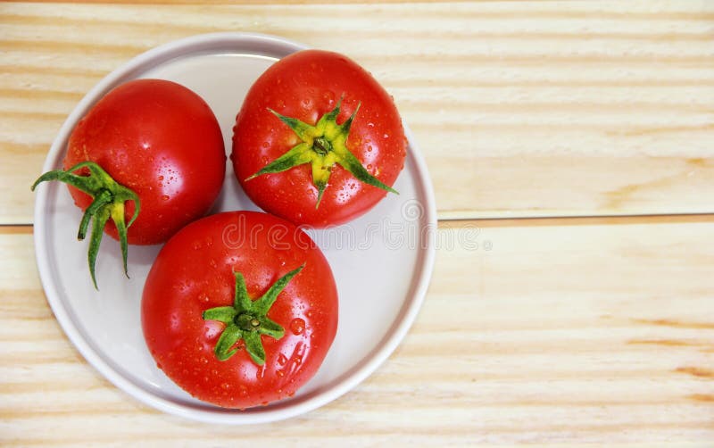 Natural Red Tomatoes on a Decorative Plate Stock Photo - Image of ...