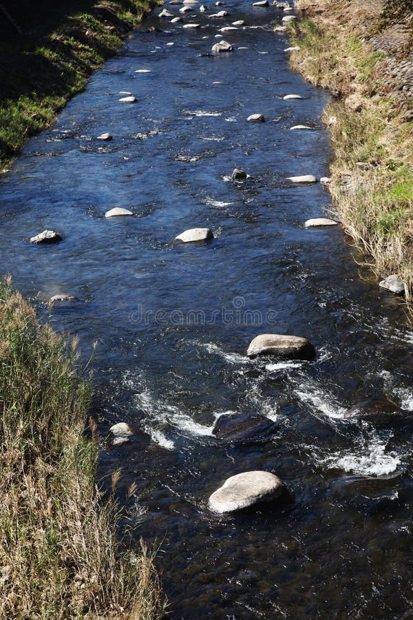 Natural stones in a river stock image. Image of rocky - 143913999