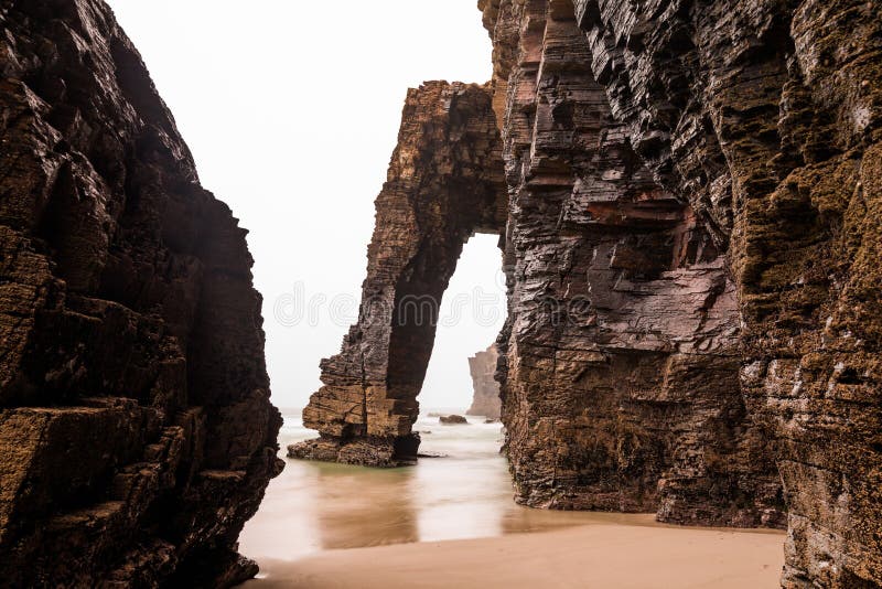 Natural Rock Arches on Cathedrals Beach in Low Tide Stock Photo - Image ...