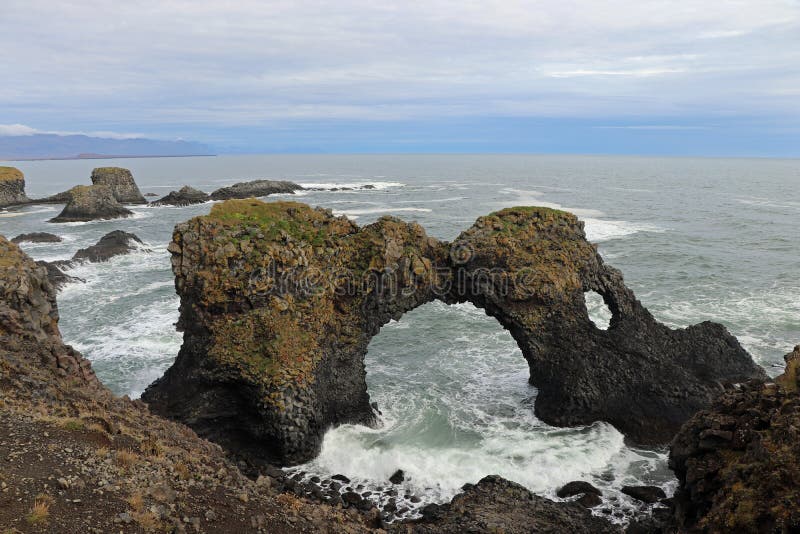 Natural Rock Gate that Rises from the Sea on Iceland Stock Photo ...