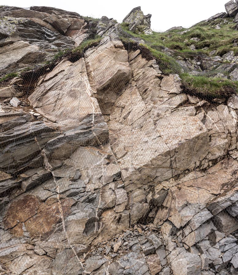 Natural Rock and Protective Mesh. Stock Photo - Image of metal, netting ...