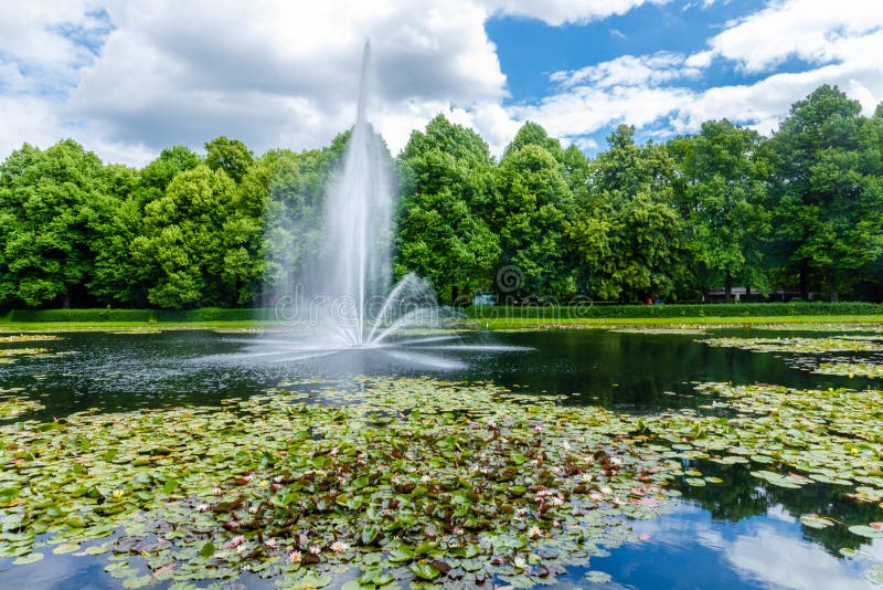 Natural Scenery on Lake with Fountain and Spring Trees Stock Photo ...