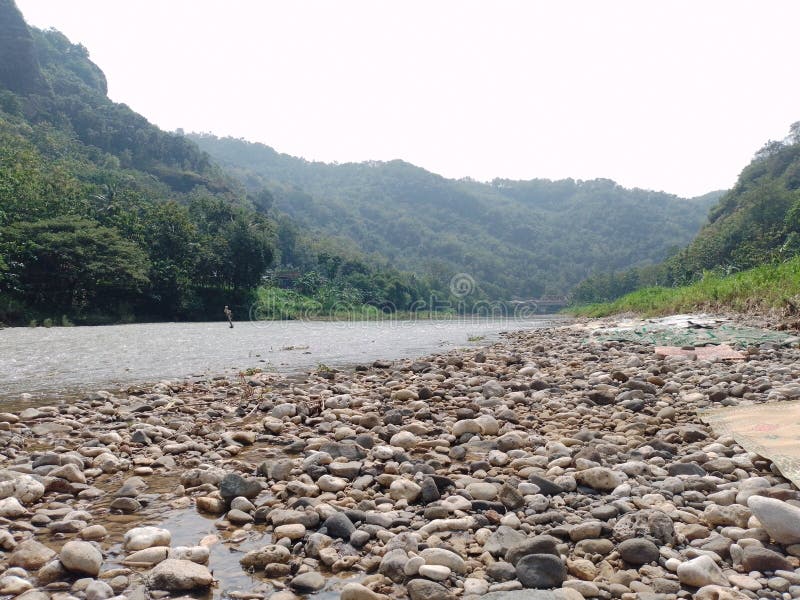 Natural Scenery of a River Landscape with a Mountain Background Stock ...