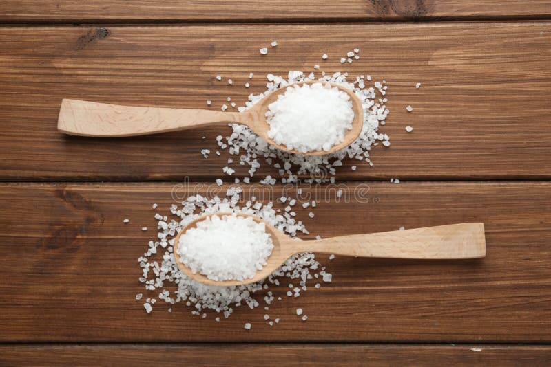 Natural Sea Salt and Spoons on Wooden Table, Flat Lay Stock Photo ...