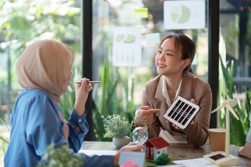 Sustainable Planning and Collaboration. Two Professionals Engage in an ...