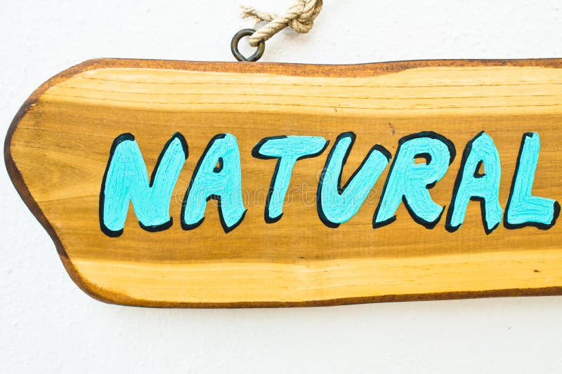 Natural - Red Sign with Clouds in Background Stock Image - Image of ...