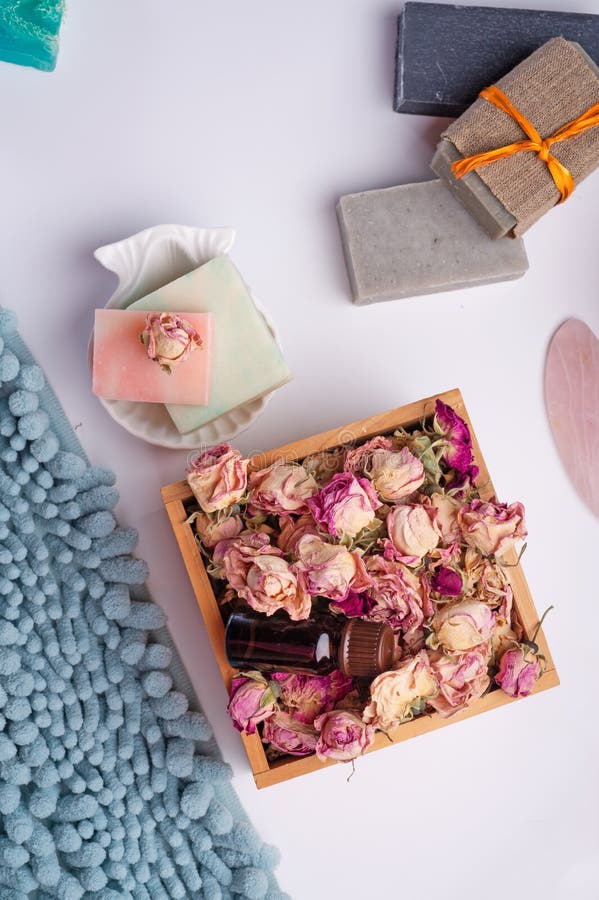 Natural Spa Set with Rose Essence, Massage Brush and Soaps on White ...