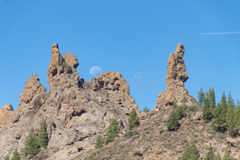 Natural Stone Monument with Moon and Airplane Flying Stock Image ...