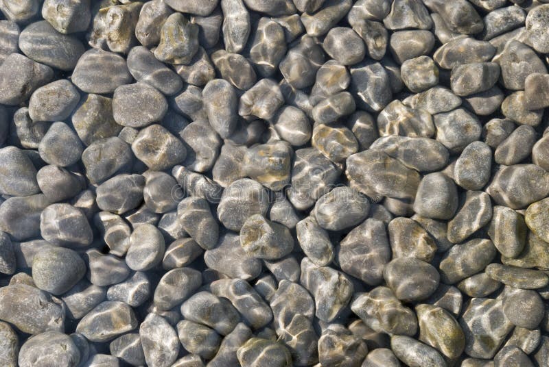Natural Stone Pebbles in Water Stock Photo - Image of random, shore ...
