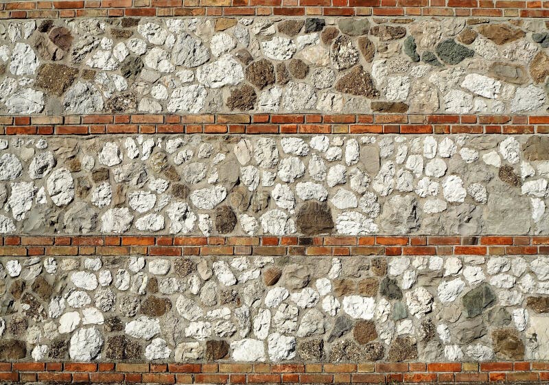 Natural Stone Wall Divided in Three Parts from Horizontal Strips of ...