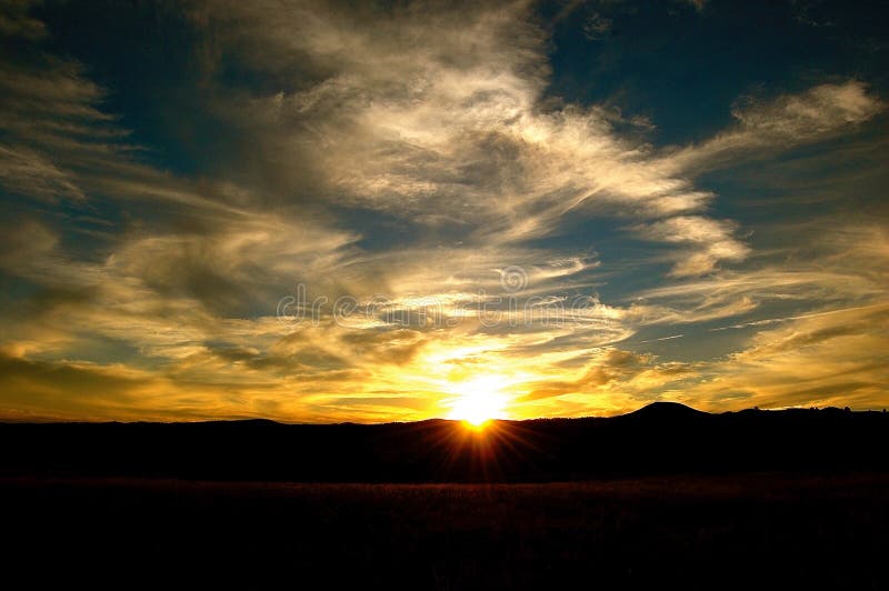 Sun Rays Gleam as it Sets stock image. Image of formation - 113701975