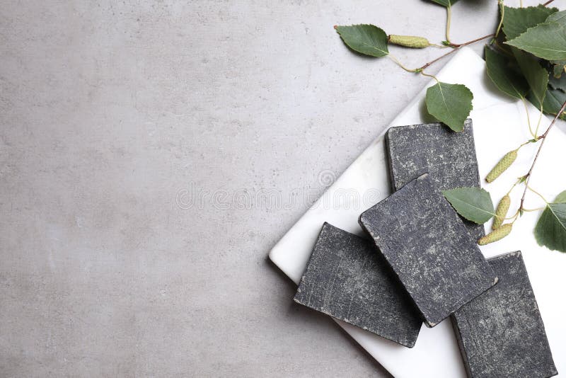 Natural Tar Soap Bars and Birch Branches on Light Grey Stone Table ...