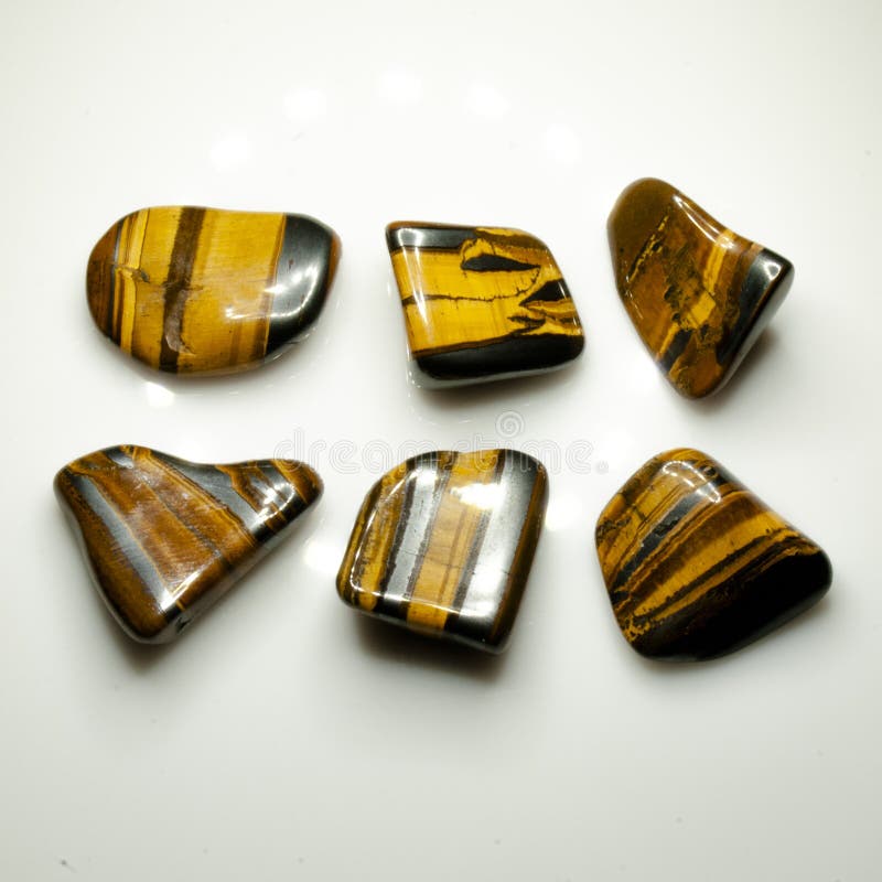 Natural Tiger S Eye Gemstones Displayed on a Light Surface Stock Photo ...