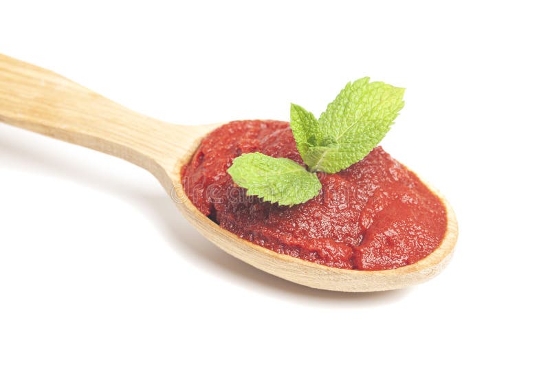 Natural Tomato Paste with Mint Leaves in Wooden Spoon Isolated on White ...