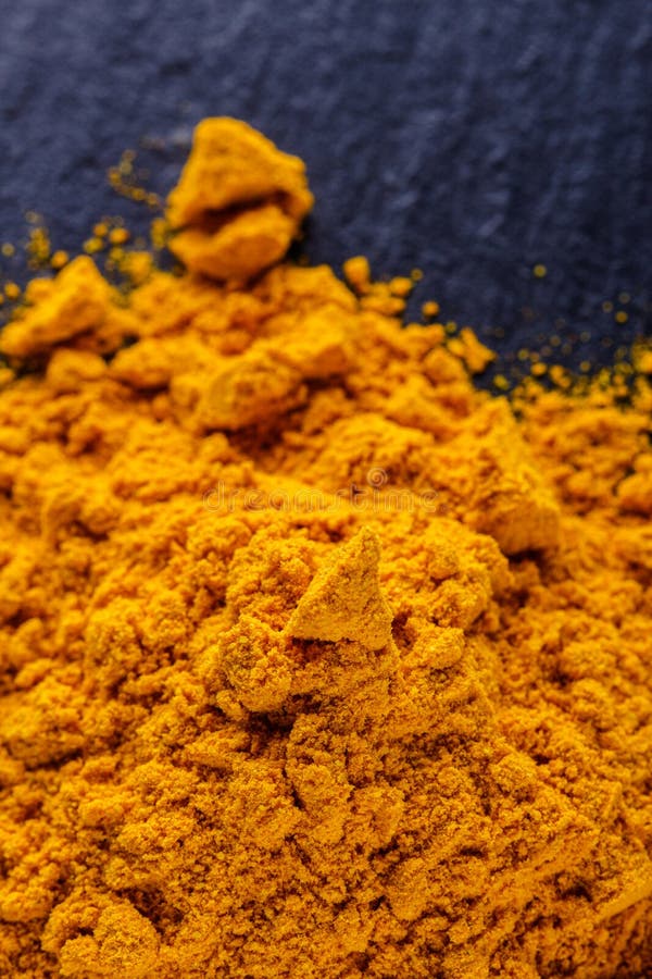 Natural Turmeric Oil in a Glass Bottle with Ground Turmeric Powder and ...