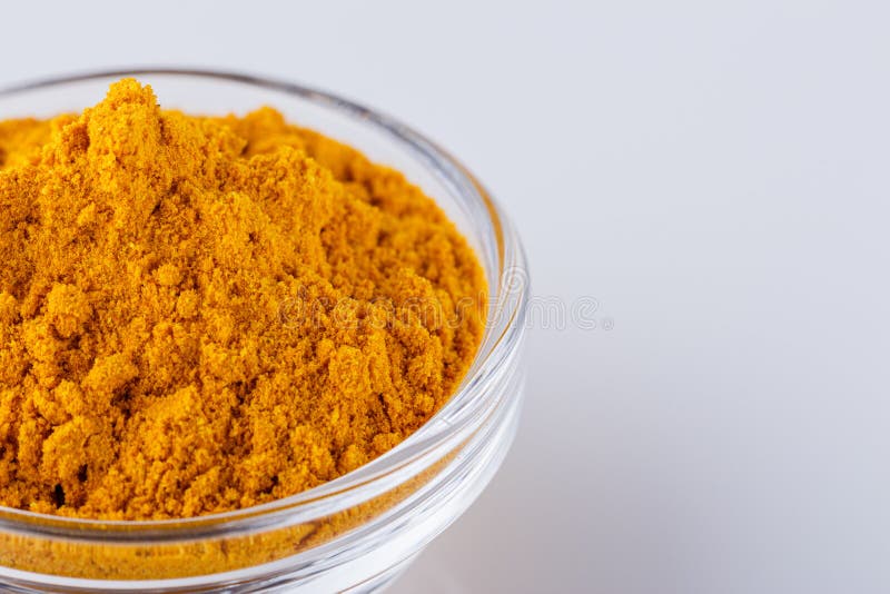 Natural Turmeric Oil in a Glass Bottle with Ground Turmeric Powder and ...