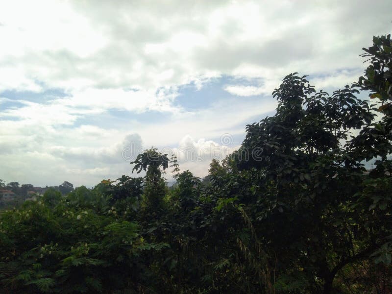 Natural View Behind the House with Beautiful Sky and Clouds Stock Photo ...